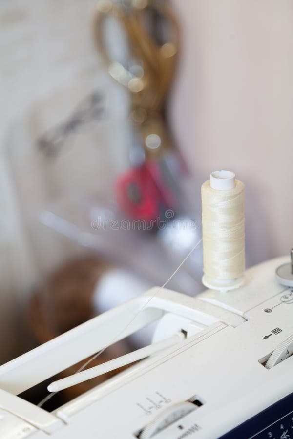 Beige Thread on Sewing Machine Stock Photo - Image of thread, mechanism ...