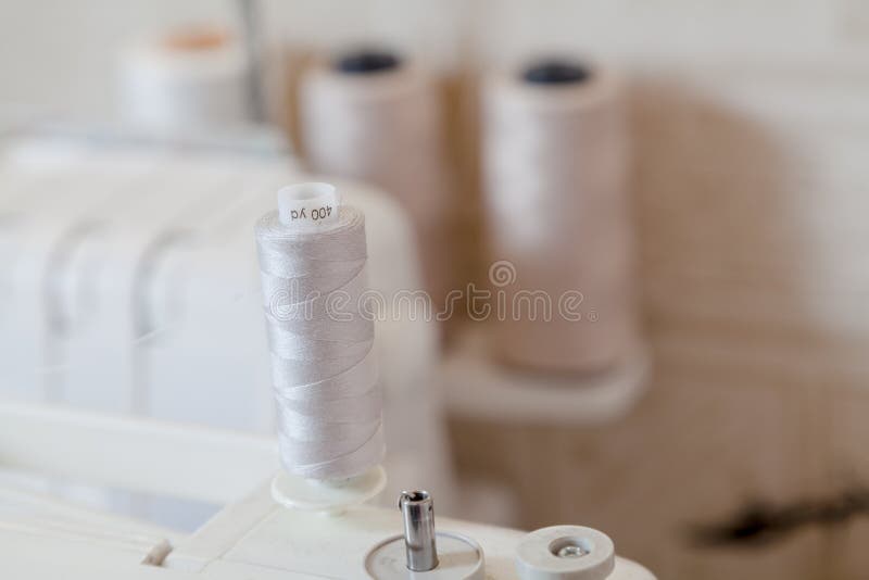 Beige Thread on Sewing Machine Stock Image - Image of fashion, stitch ...
