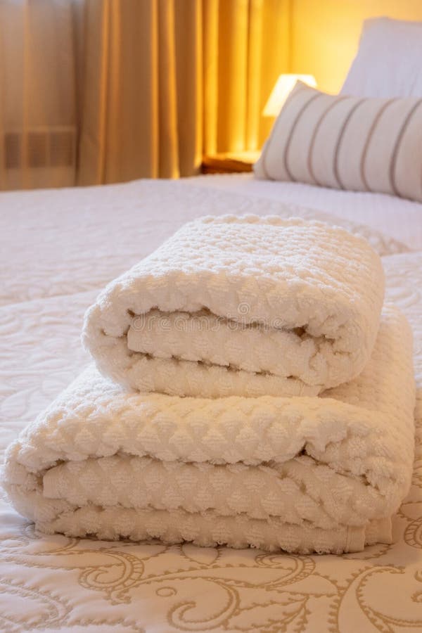 Beige Towel on Bed in Guest Room in Hotel Stock Image - Image of soft ...