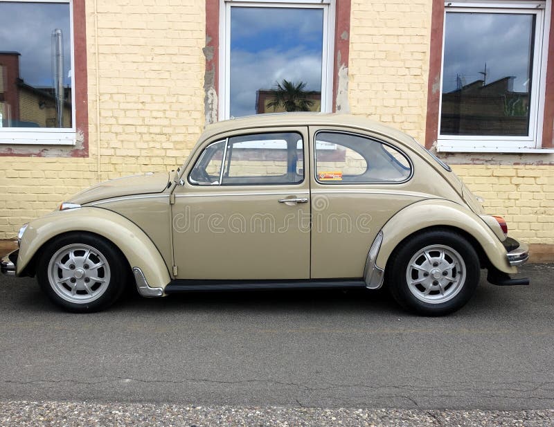 Beige Volkswagen Beetle Parked by a Brick Building Editorial Stock ...