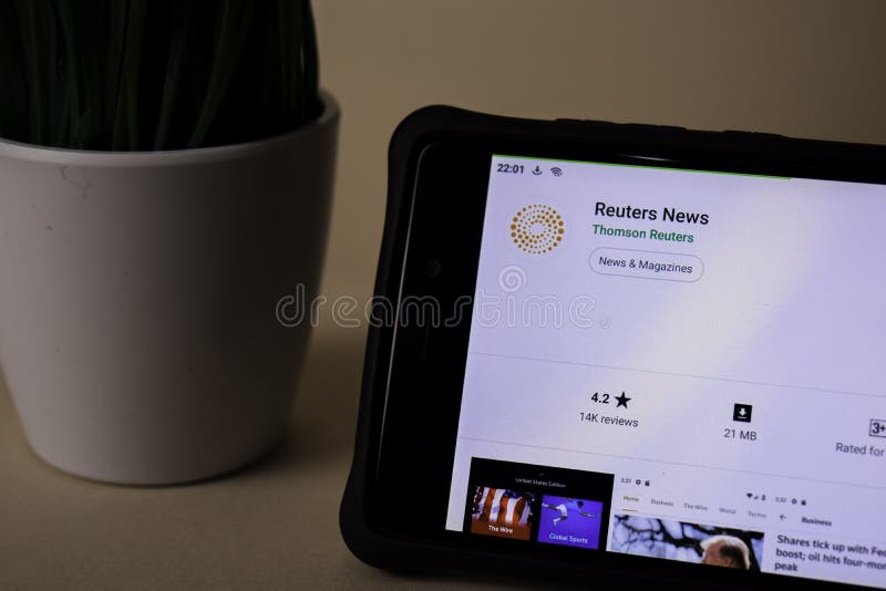 Reuters News Dev Application on Smartphone Screen. Reuters is a ...
