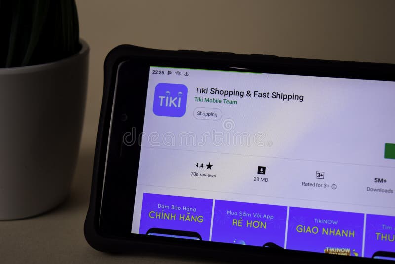Tiki Shopping Dev Application on Smartphone Screen. Fast Shipping is a ...
