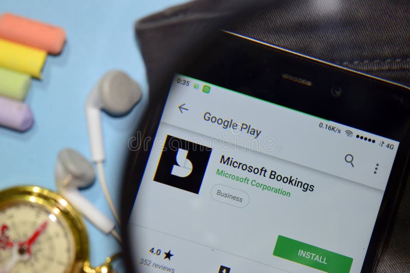 Microsoft Booking Dev App with Magnifying on Smartphone Screen ...