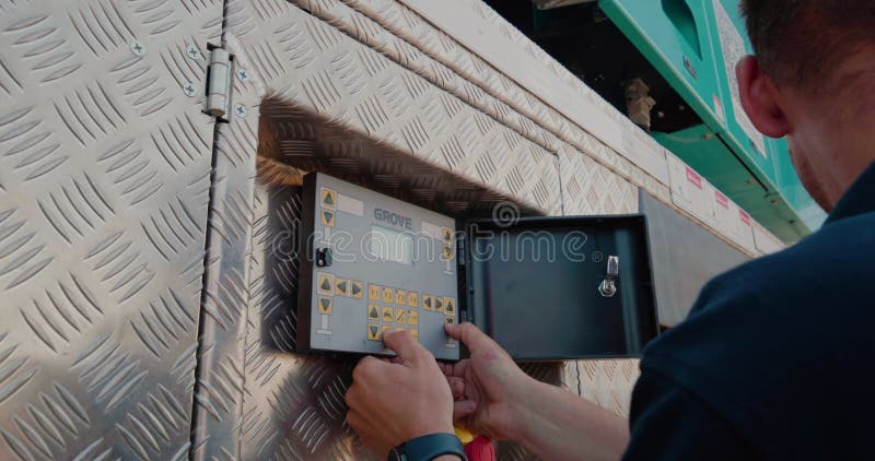 A Mobile Crane Operator`s Hand Holding a Joystick To Control a Crane ...