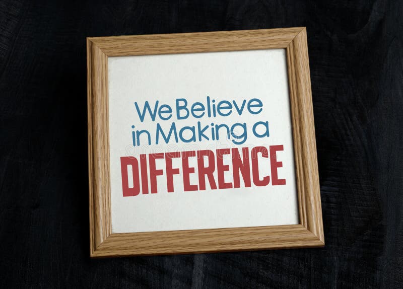 We Beleive in Making a Difference in Wood Photo Frame Stock Image ...
