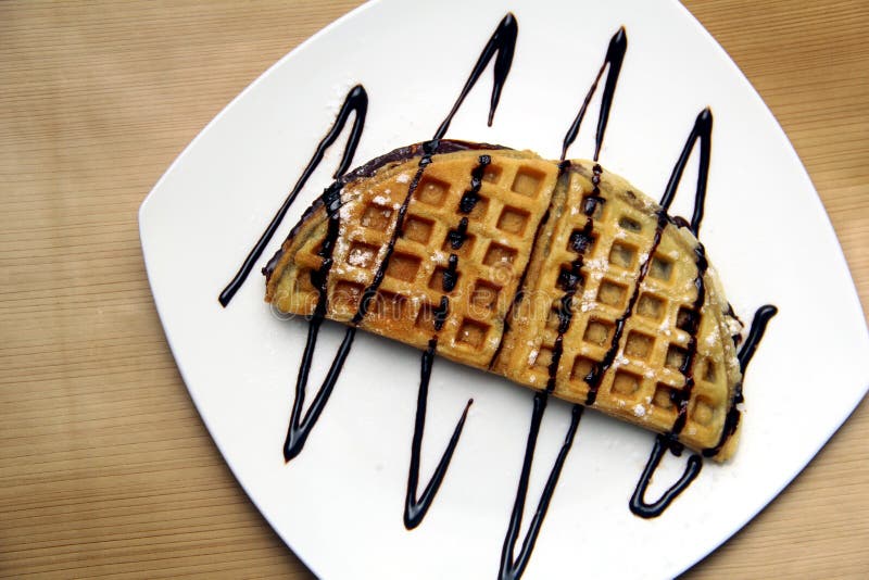 Belgian Waffle with Chocolate Filling and Drizzle Stock Photo - Image ...