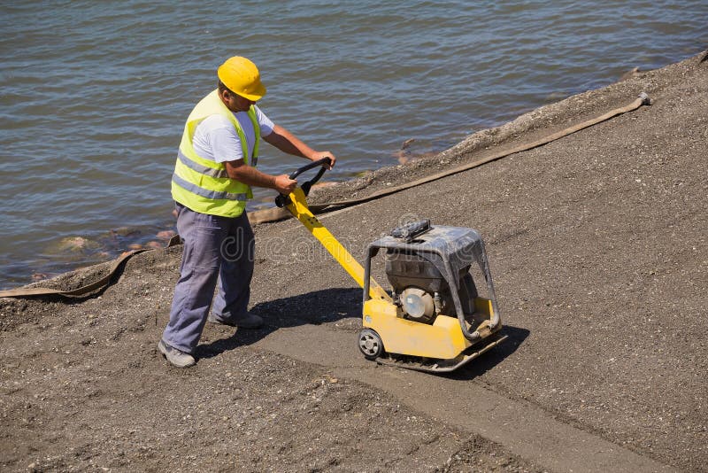 Builder Worker at Sand Ground Compaction Editorial Photo - Image of ...