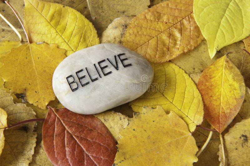 Believe Rock with Fall Leaves Stock Image - Image of believe, autumn ...