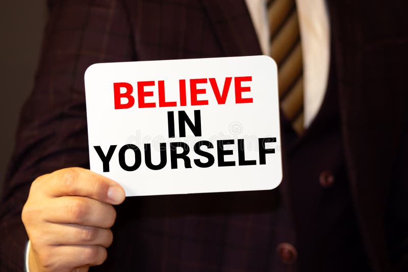 Believe In Yourself Written On An Yellow Sticky Note On A Cork