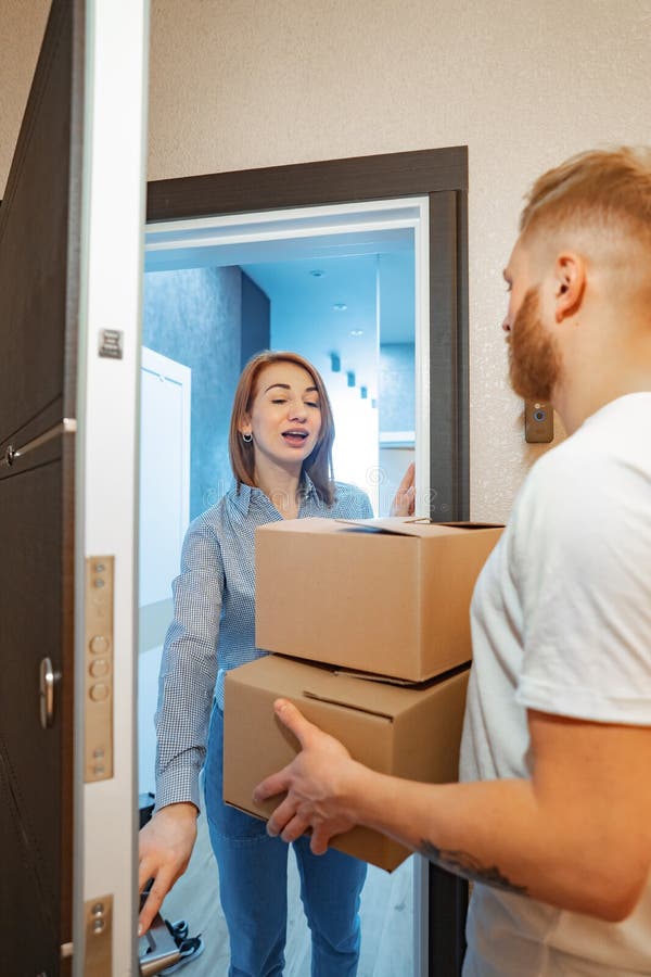 Belivery Man Delivering Parcel Box To Recipient. Stock Photo - Image of ...