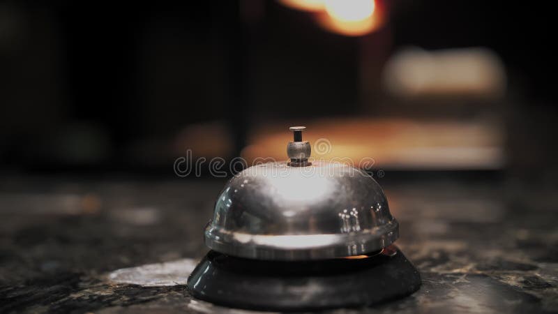 Bell on the Counter. Service Bell. Silver Call Bell on Table in a ...