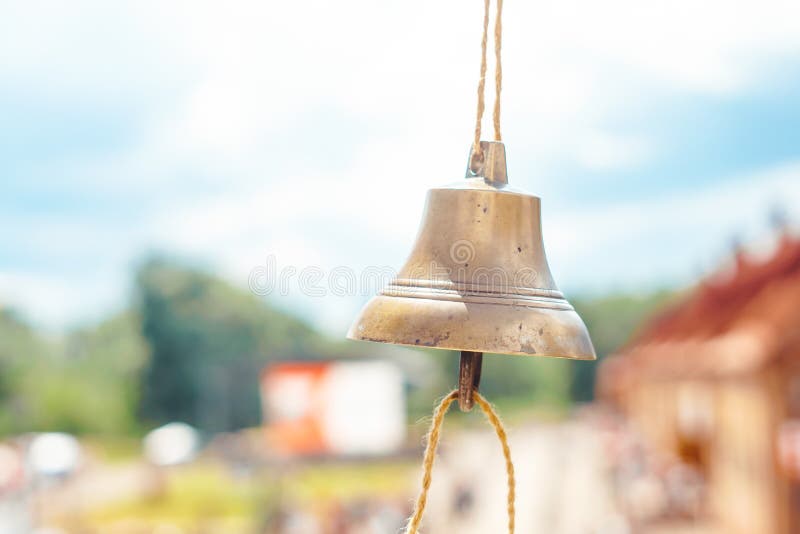The bell hangs on a rope stock image. Image of closeup - 131153291