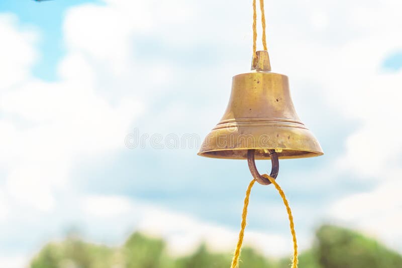 The bell hangs on a rope stock photo. Image of angle - 131088856