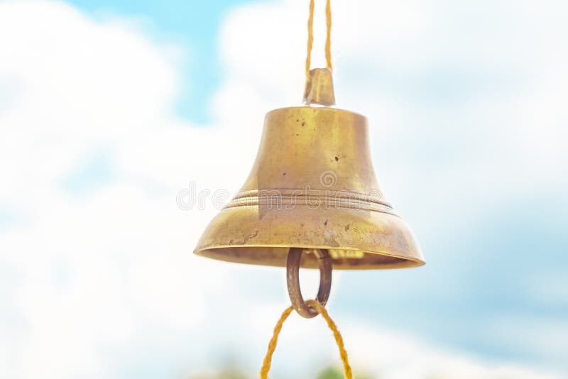 The bell hangs on a rope stock photo. Image of decoration - 132713854
