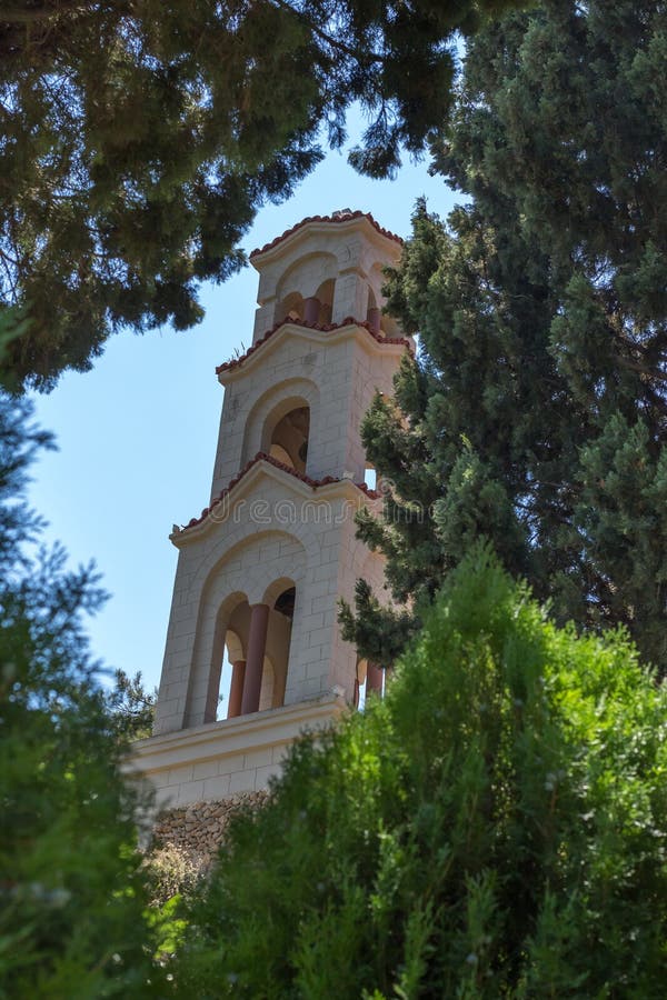 The Bell Tower of the Church Next To the Tree. Stock Photo - Image of ...