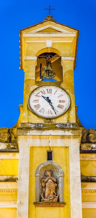 Bell tower with clock stock photo. Image of blessed, crucifix - 71912082