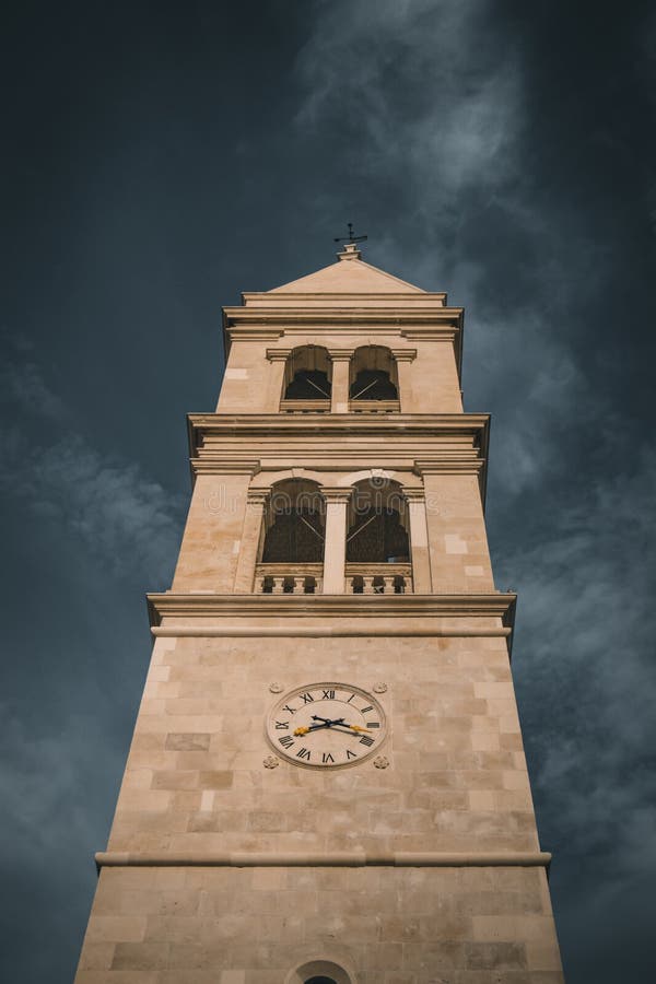 Bell tower with a clock stock image. Image of building - 124953807