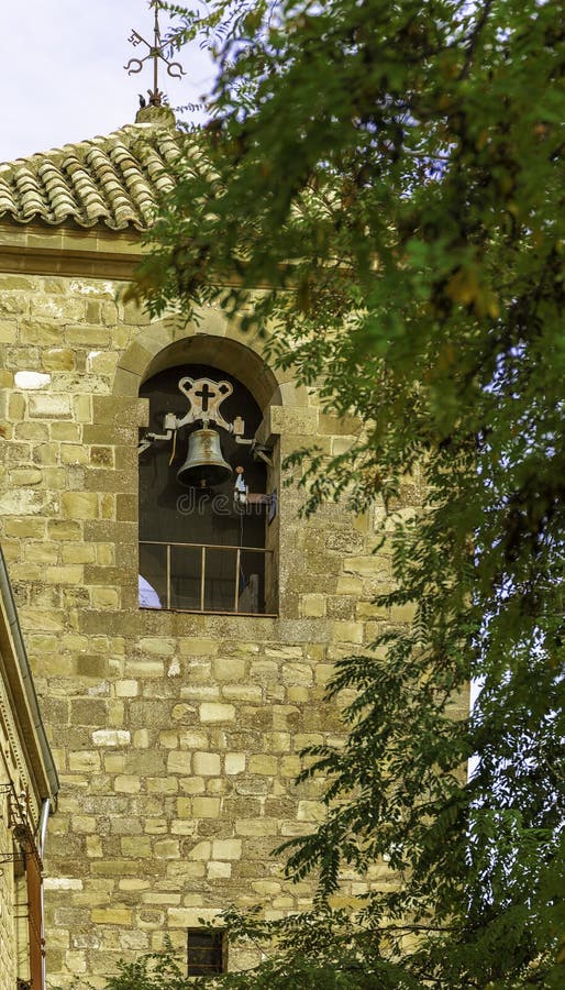 A Bell Tower with a Bell Hanging from it Stock Image - Image of green ...