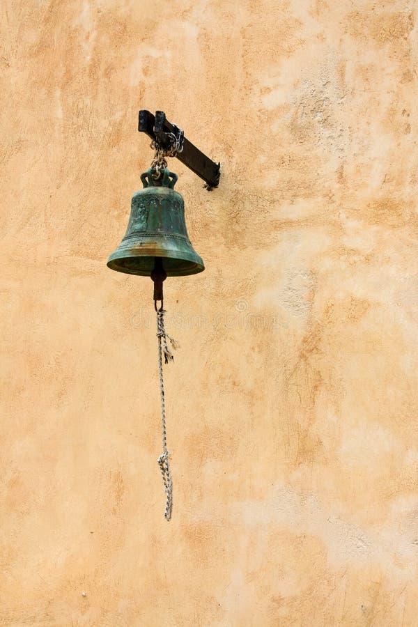Bell of a Village Chapel on the Wall Stock Image - Image of rope ...