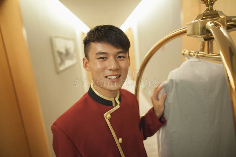 Bellhop with Luggage Cart stock photo. Image of service - 11185436