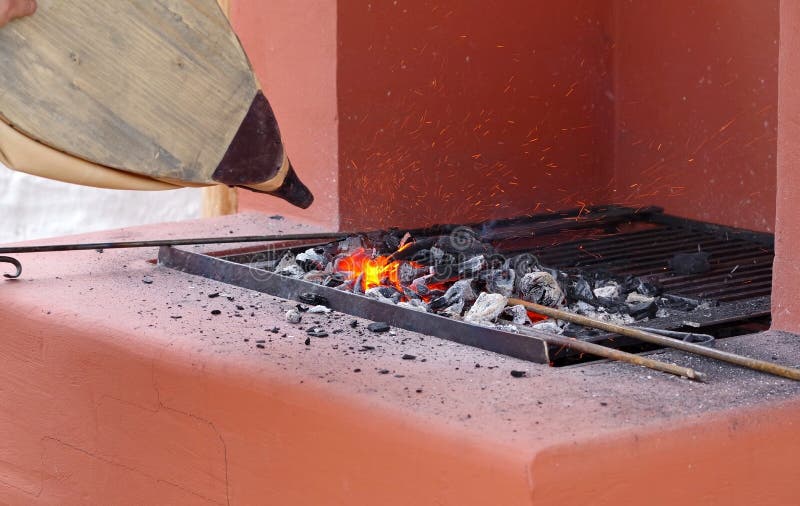 Bellows of the Blacksmith Fanning the Fire in the Coals Stock Photo ...