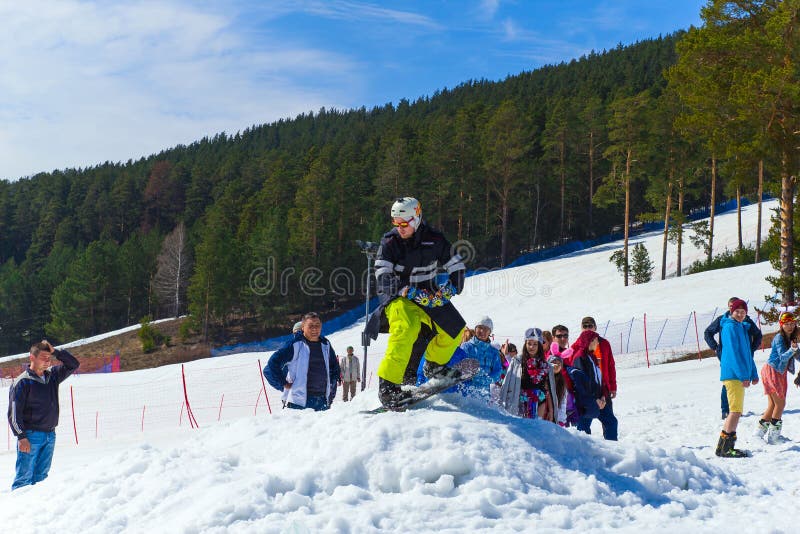 BELORETSK,RUSSIA, 13 APRIL 2019 Man on Snowboard Makes a Jump on a Ski ...