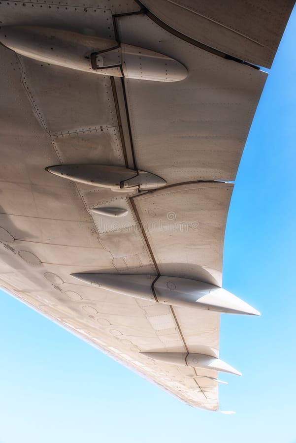 Below an Aircraft Wing stock photo. Image of flight - 165632962