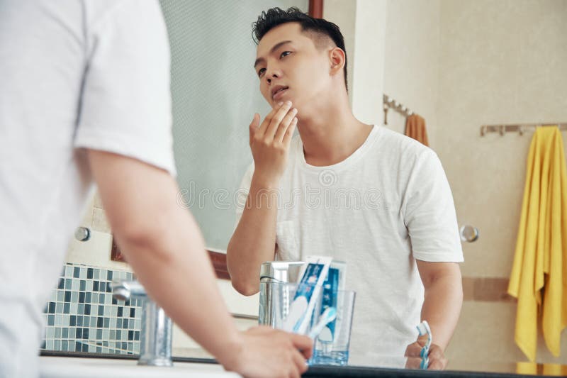 Ethnic Man Pampering Skin in Mirror Stock Image - Image of fresh ...