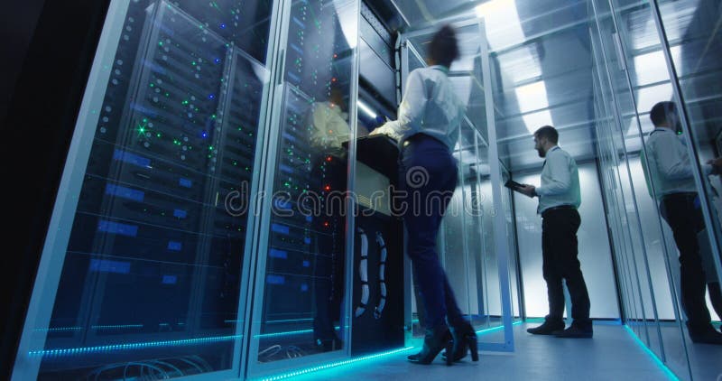 It Workers in Glowing Data Center Stock Video - Video of equipment ...