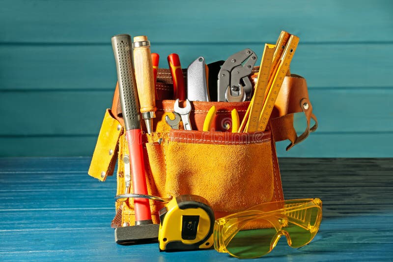 Belt with Different Tools on Blue Wooden Table Stock Image - Image of ...