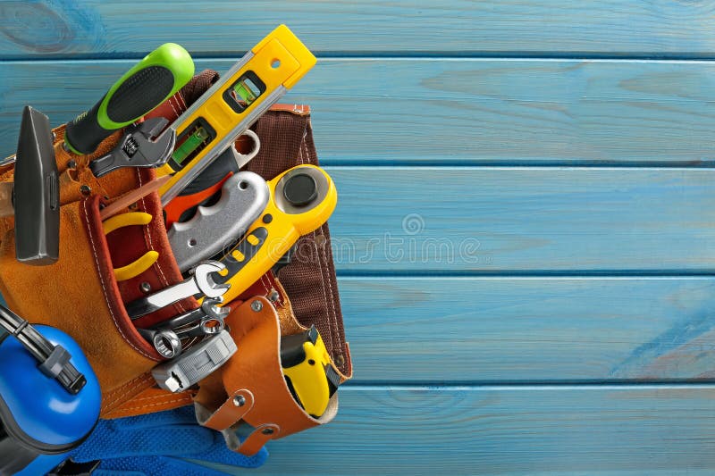 Belt with Different Tools on Light Blue Wooden Table, Top View. Space ...