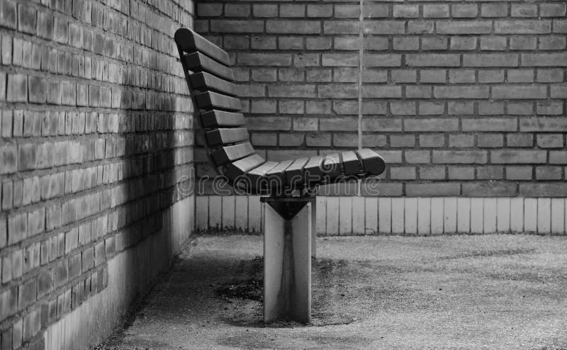 Bench against the wall stock photo. Image of bench, blackandwhite ...
