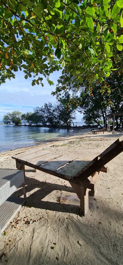 A Bench by the Beach in the Morning Stock Photo - Image of waterway ...