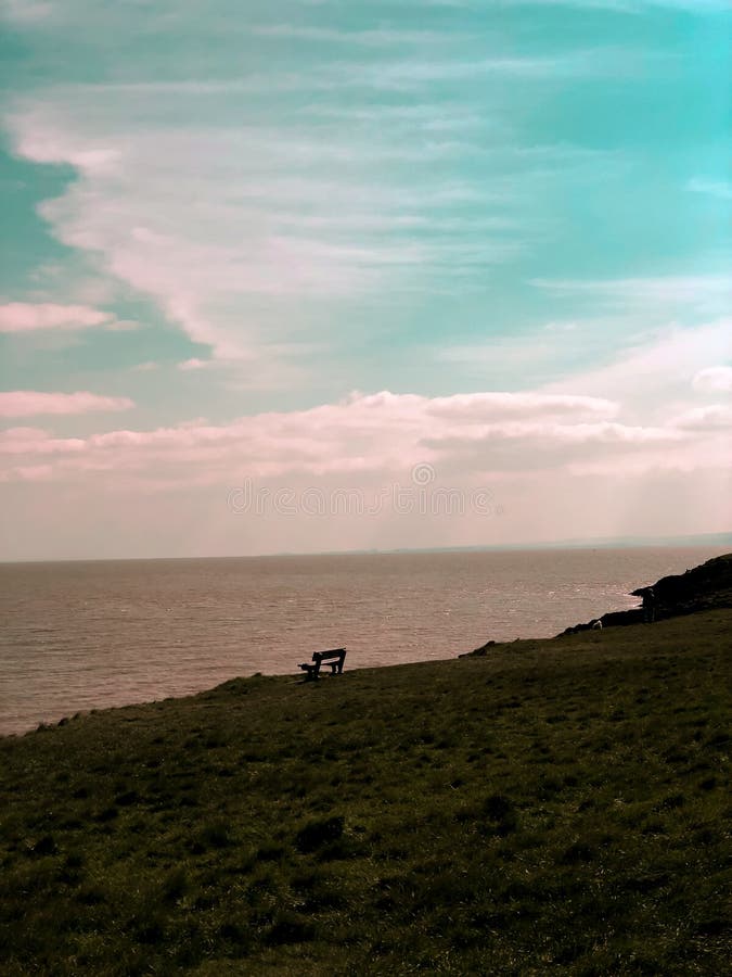 Bench on a Cliff with Sea and Clouds Stock Photo - Image of horizon ...