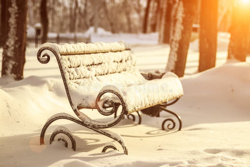 The Bench is Covered with Snow and Ice Stock Photo - Image of city ...