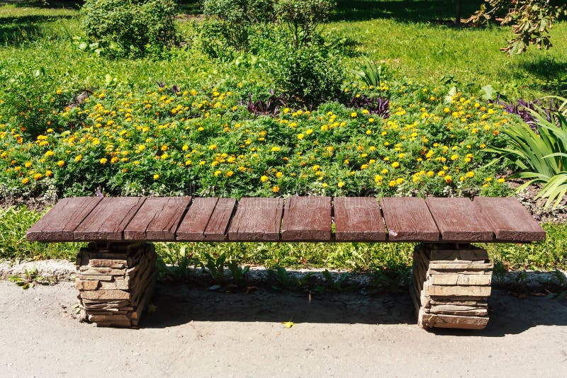 Bench and flowers stock image. Image of bloom, blossom - 76621709