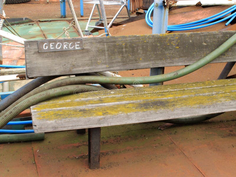 A bench for George stock image. Image of seat, written - 43979047
