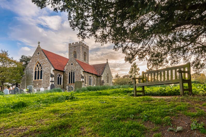 A Bench on the Grass in Front of the Church. Stock Image - Image of ...