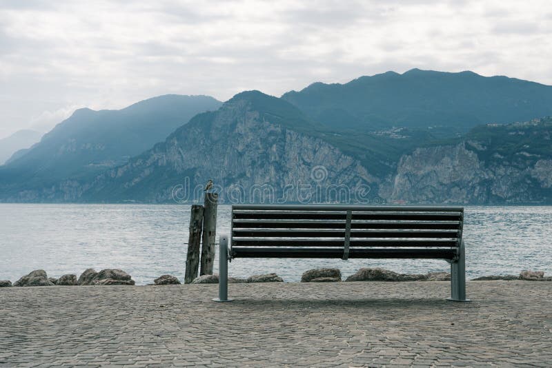 Bench by Lake Garda Facing Villages on the Mountain Stock Image - Image ...