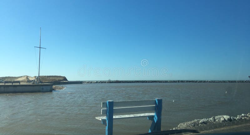 Bench stock photo. Image of blue, michigan, water, bench - 146240456