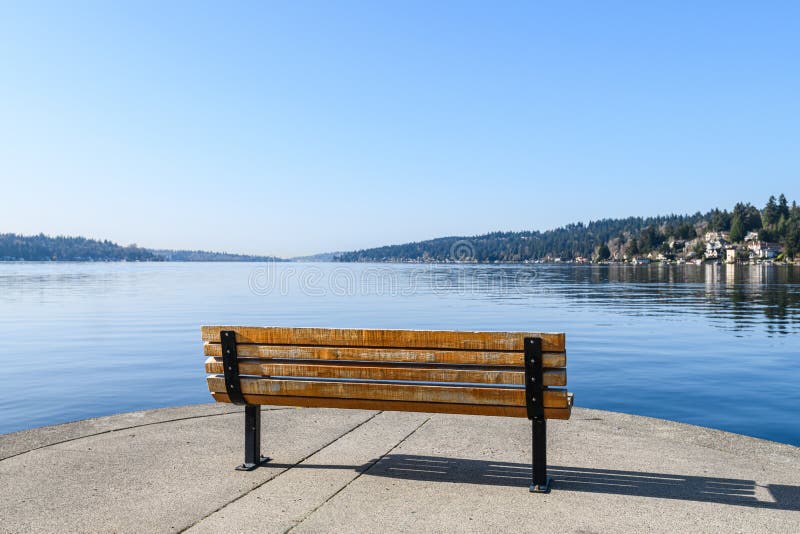 An Empty Bench Overlooks Lake Washington in Bellevue Stock Photo ...