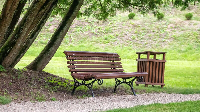 Bench in the local park stock photo. Image of land, landscaped - 249472730