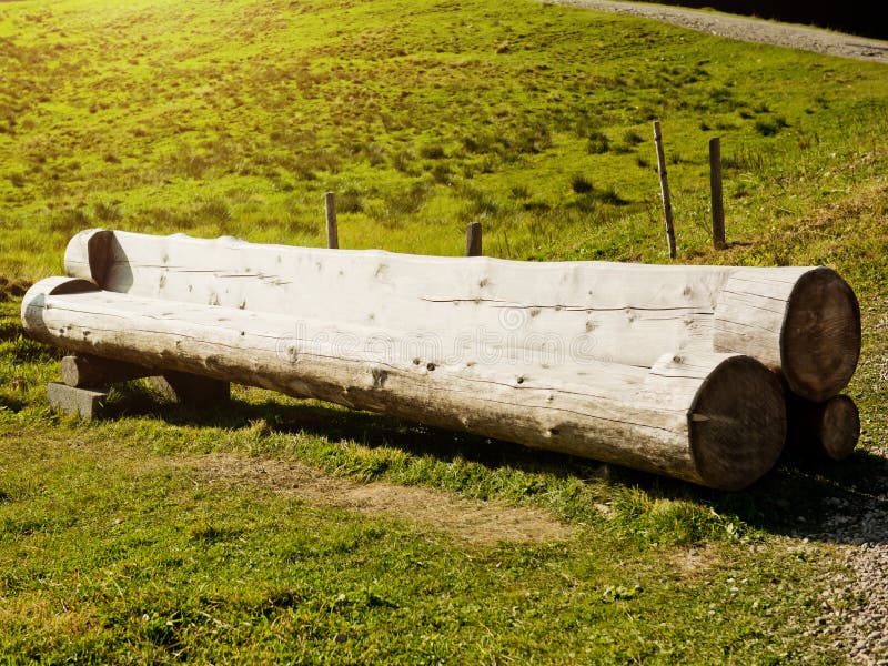A Bench Made of Logs on the Side of a Mountain. Stock Image - Image of ...