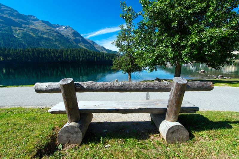 Bench on the mountain lake stock photo. Image of view - 58633378