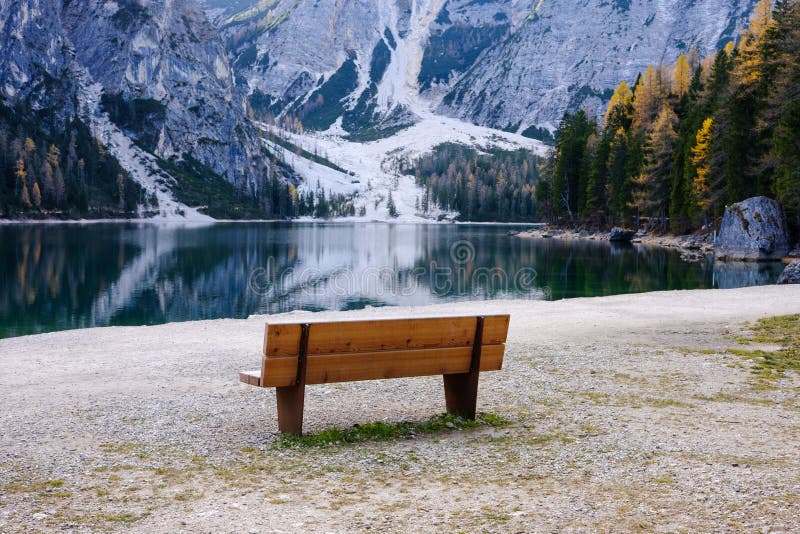 Bench near mountain lake stock image. Image of tyrol - 184100239