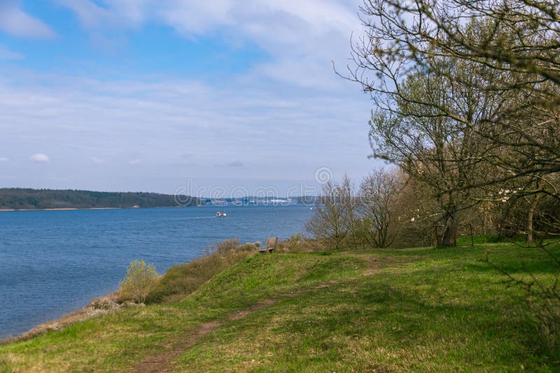 A Bench with a Nice View To Travemuende Stock Photo - Image of grass ...