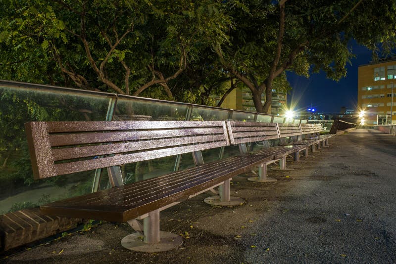 Bench in the night stock photo. Image of skyscraper, background - 36122782