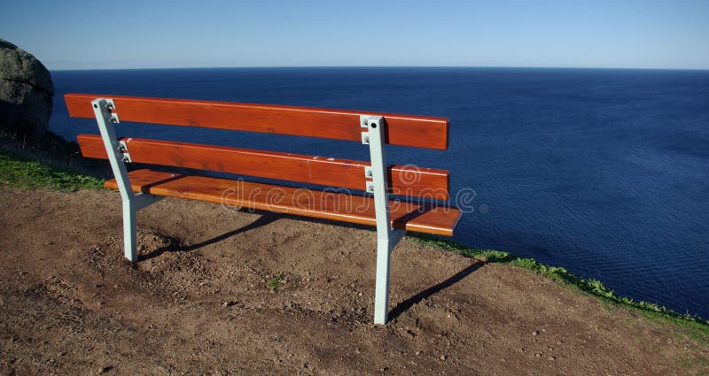 Bench with an ocean view stock photo. Image of evening - 14653930