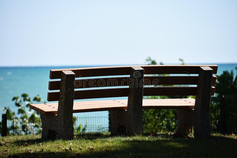 Bench overlooking sea stock photo. Image of rewild, nature - 99593274