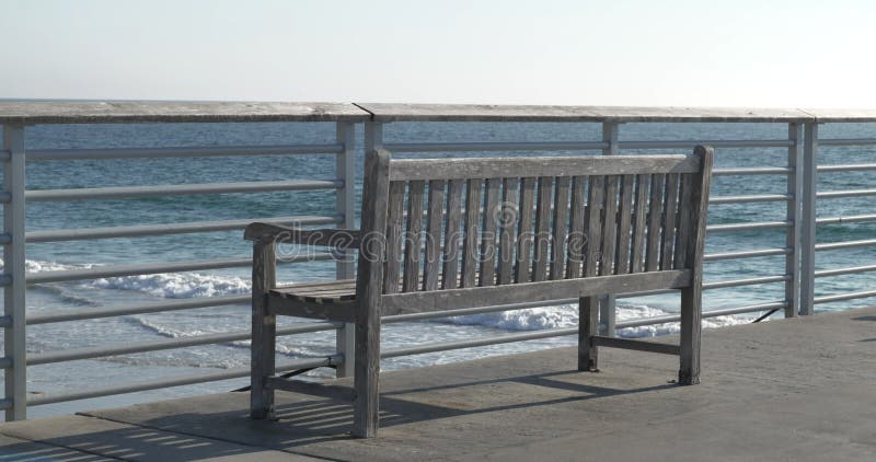 Bench on a Pier Overlooking the Pacific Ocean at a Tropical Resort ...